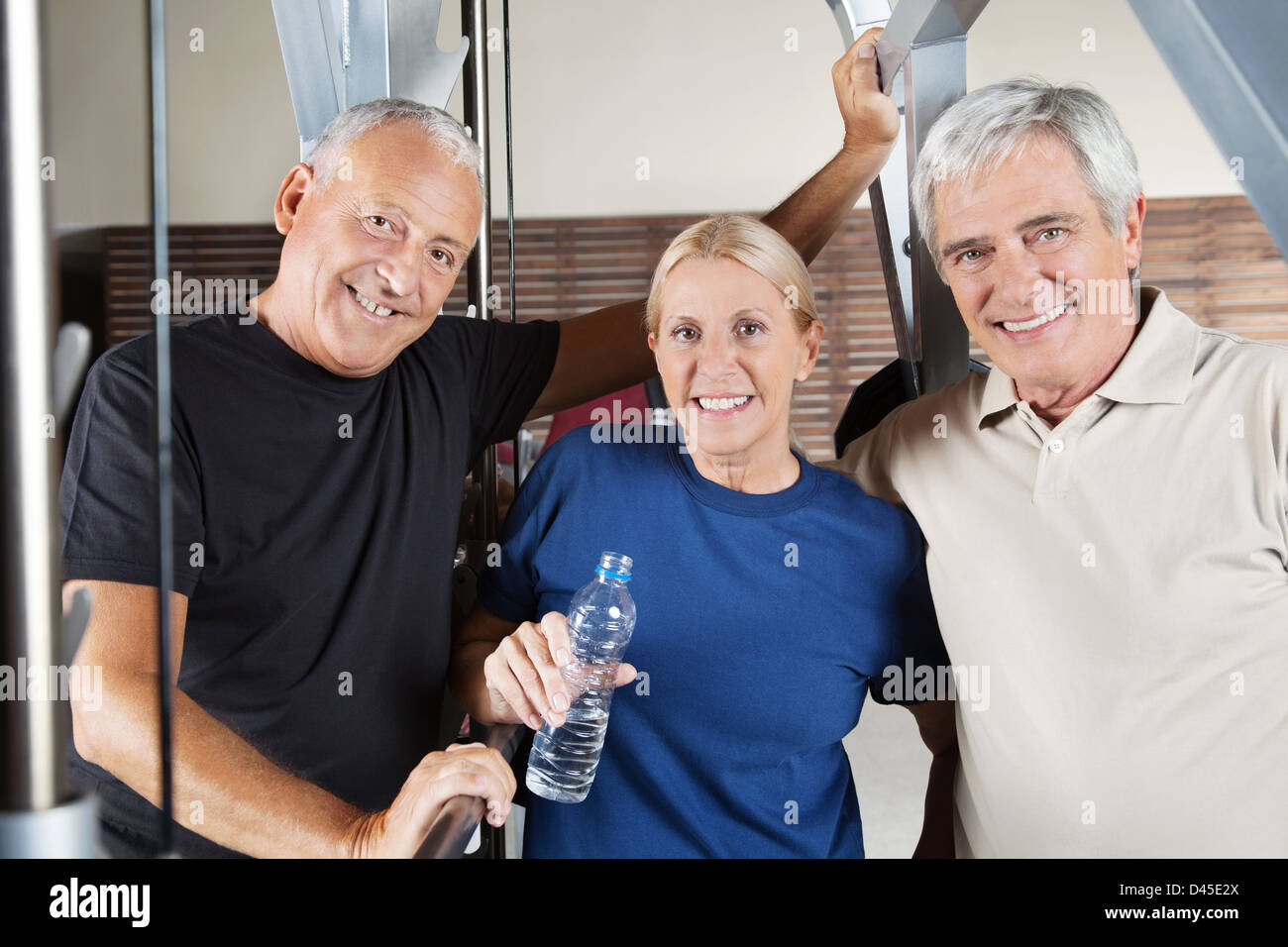 Active smiling senior fitness group in a gym Stock Photo - Alamy