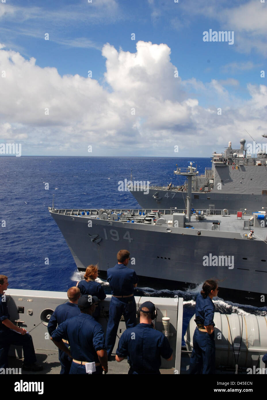 Two U.S. Navy ships conduct a replenishment at sea operation in the ...