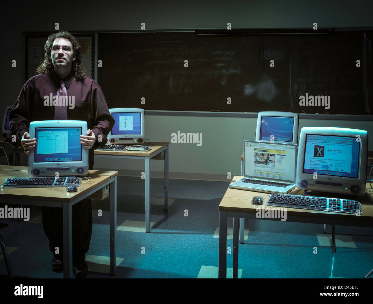 Teacher in computer lab Stock Photo - Alamy