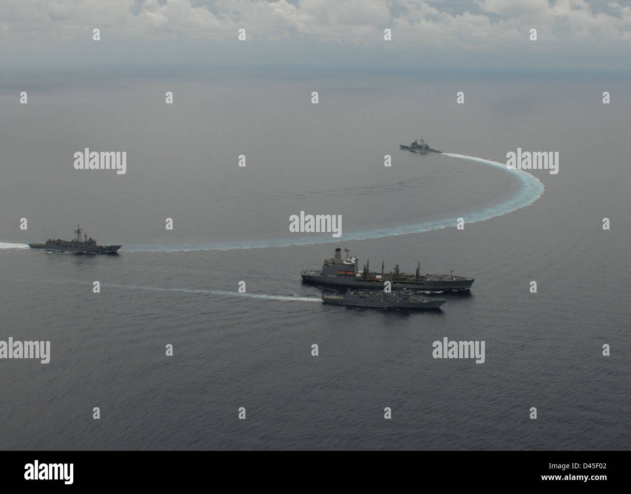 Ships conduct underway replenishment in the Caribbean Sea to maintain ...