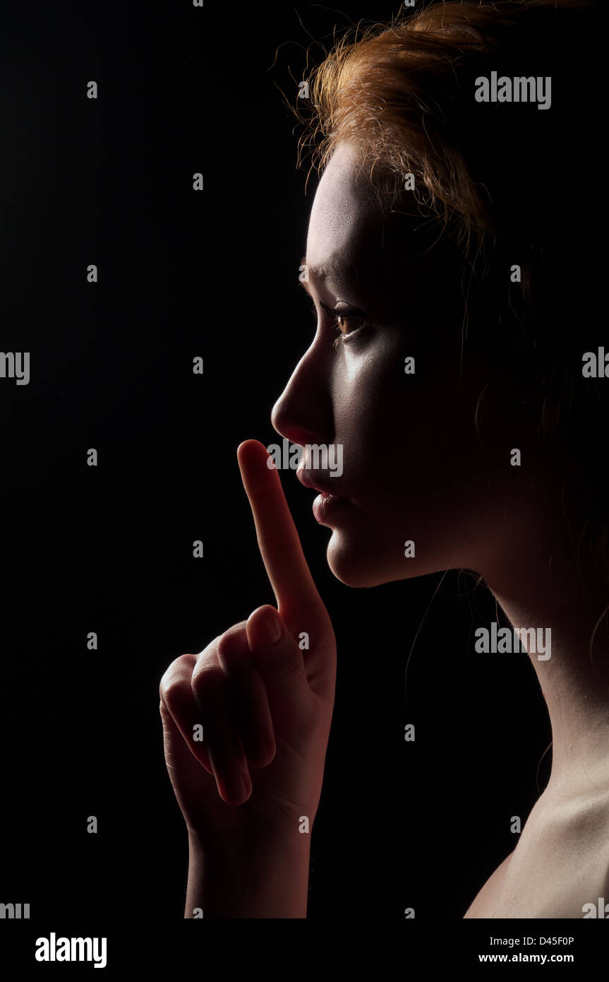 Young Woman With Red Hairs Gesturing For Being Quiet, Shows Silence ...