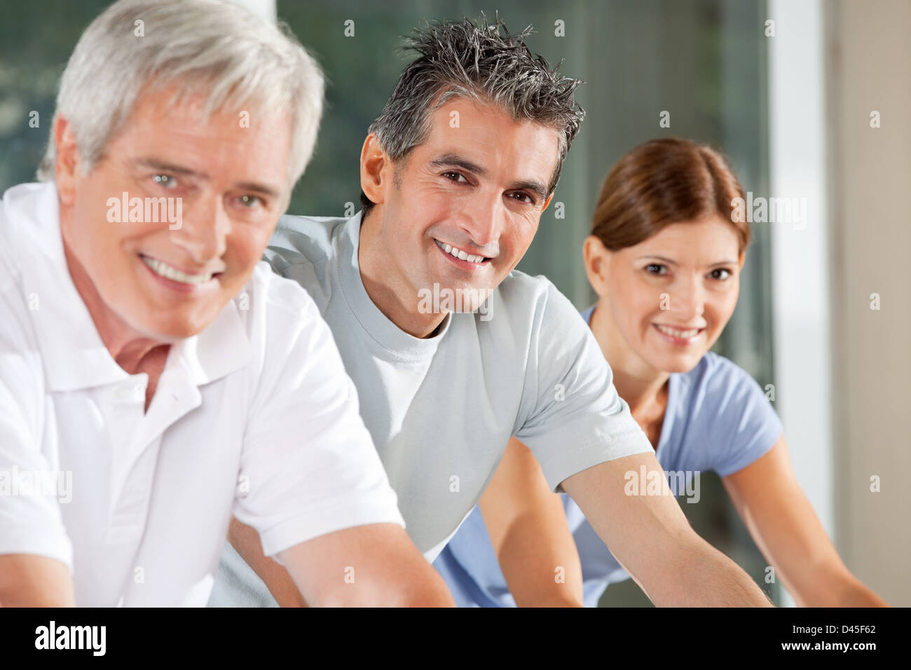 Portrait of smiling elderly people in fitness center Stock Photo - Alamy