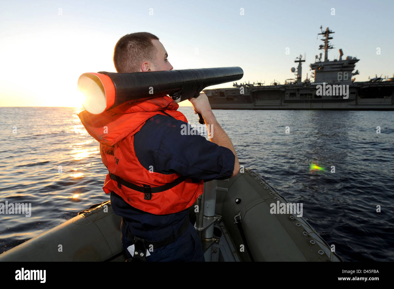 A Sailor practices with a simulated rocket launcher aboard a U.S. Navy ...