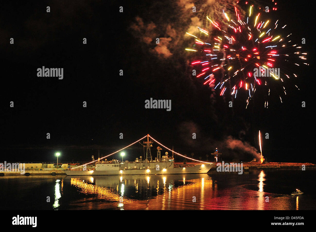 Fireworks light up the sky above the USS De Wert (FFG 45), a U.S. Navy ...