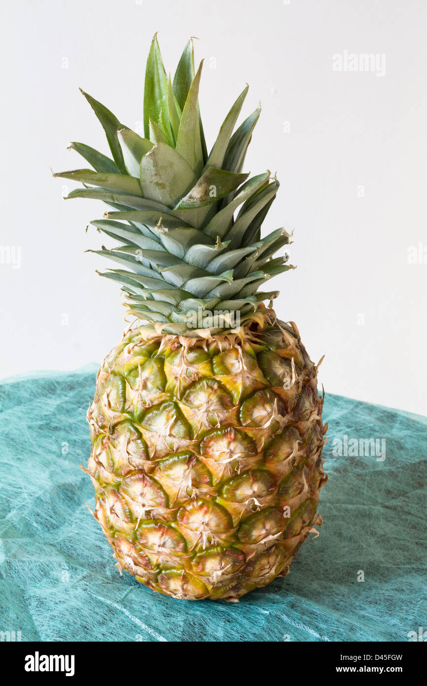 Pineapple on table Stock Photo - Alamy