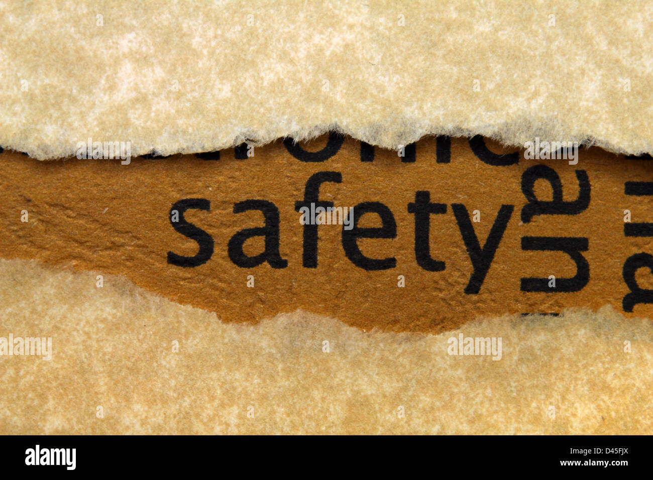 Safety text on paper hole Stock Photo - Alamy