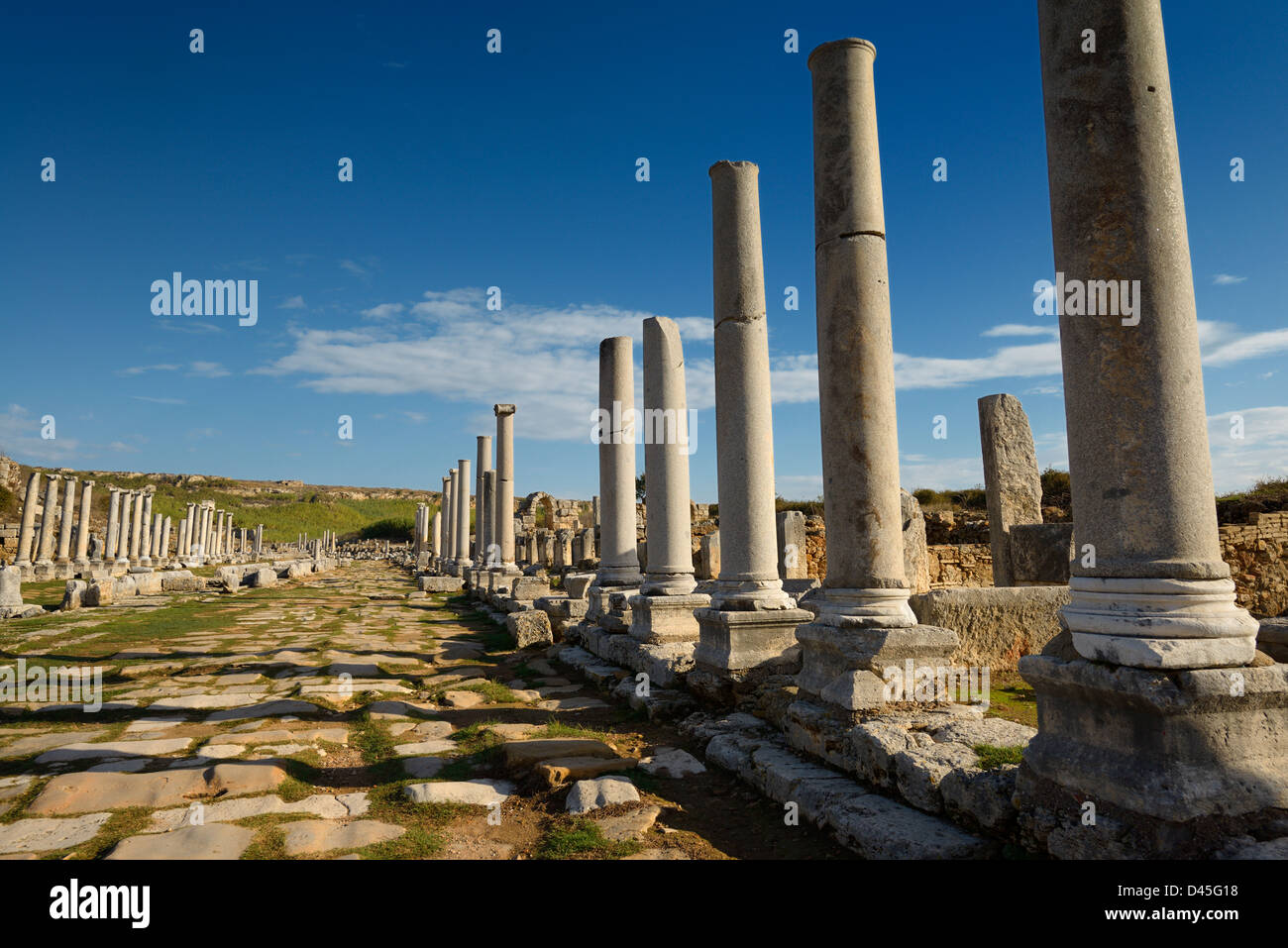 Colonnade and canal on the main street of Perge archaeological site ...