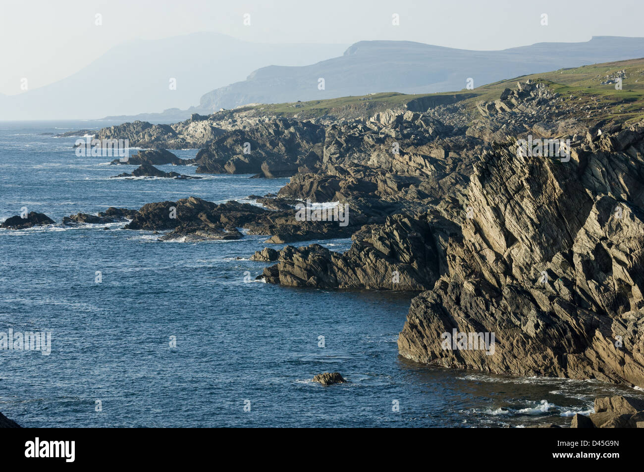 Rugged and rocky cliffs on the coastline of Achill Island, Westport ...