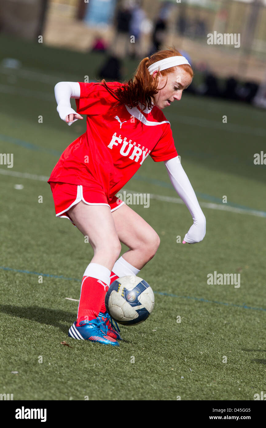 Teen girls soccer action Stock Photo - Alamy