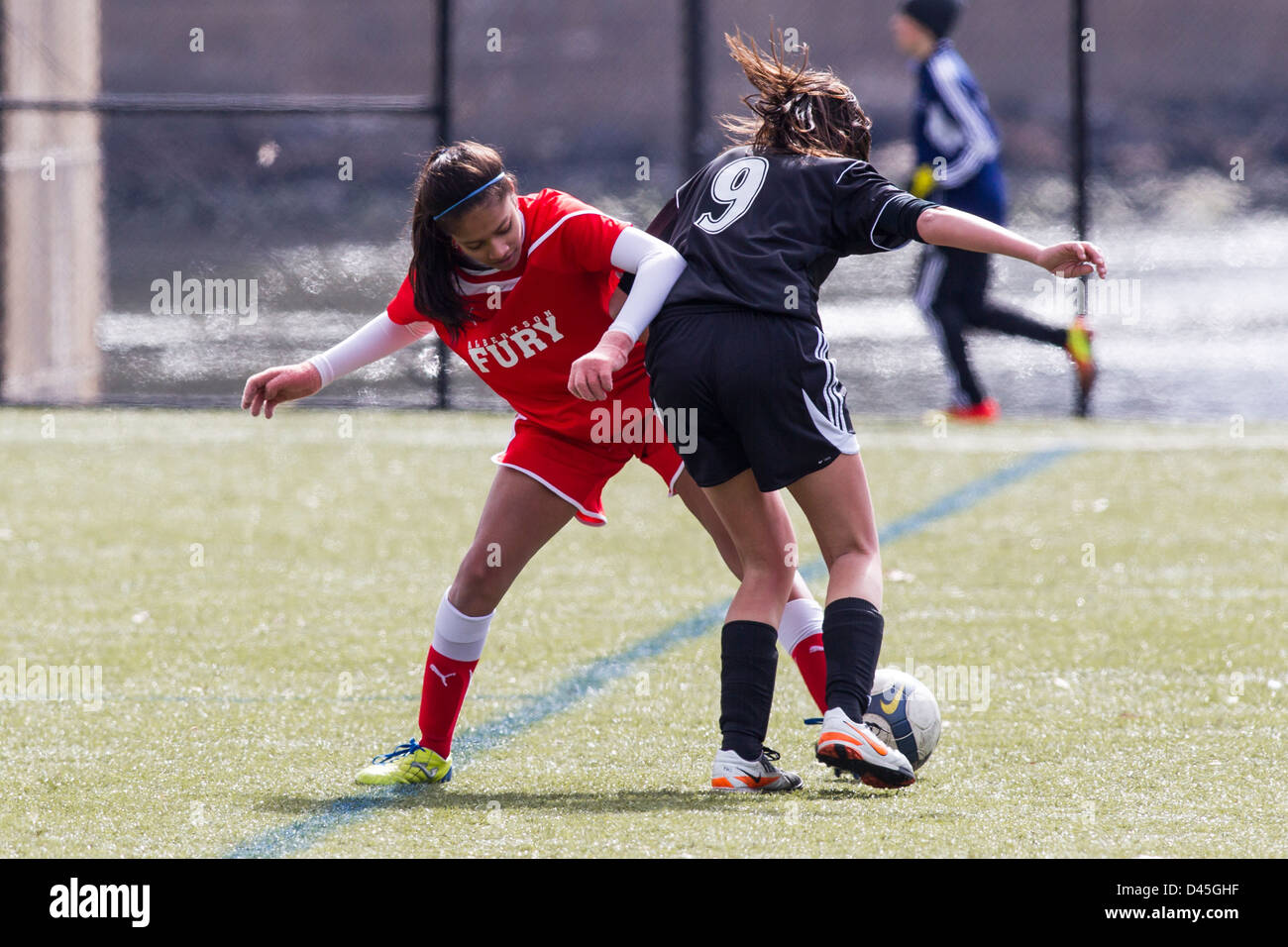 Teen girls soccer action Stock Photo - Alamy