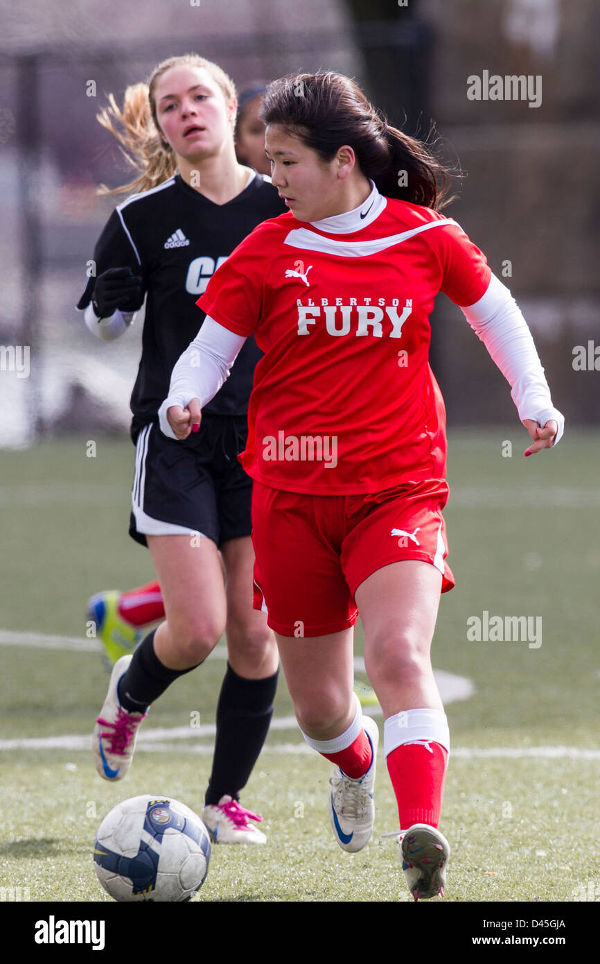 Teen girls soccer action Stock Photo - Alamy