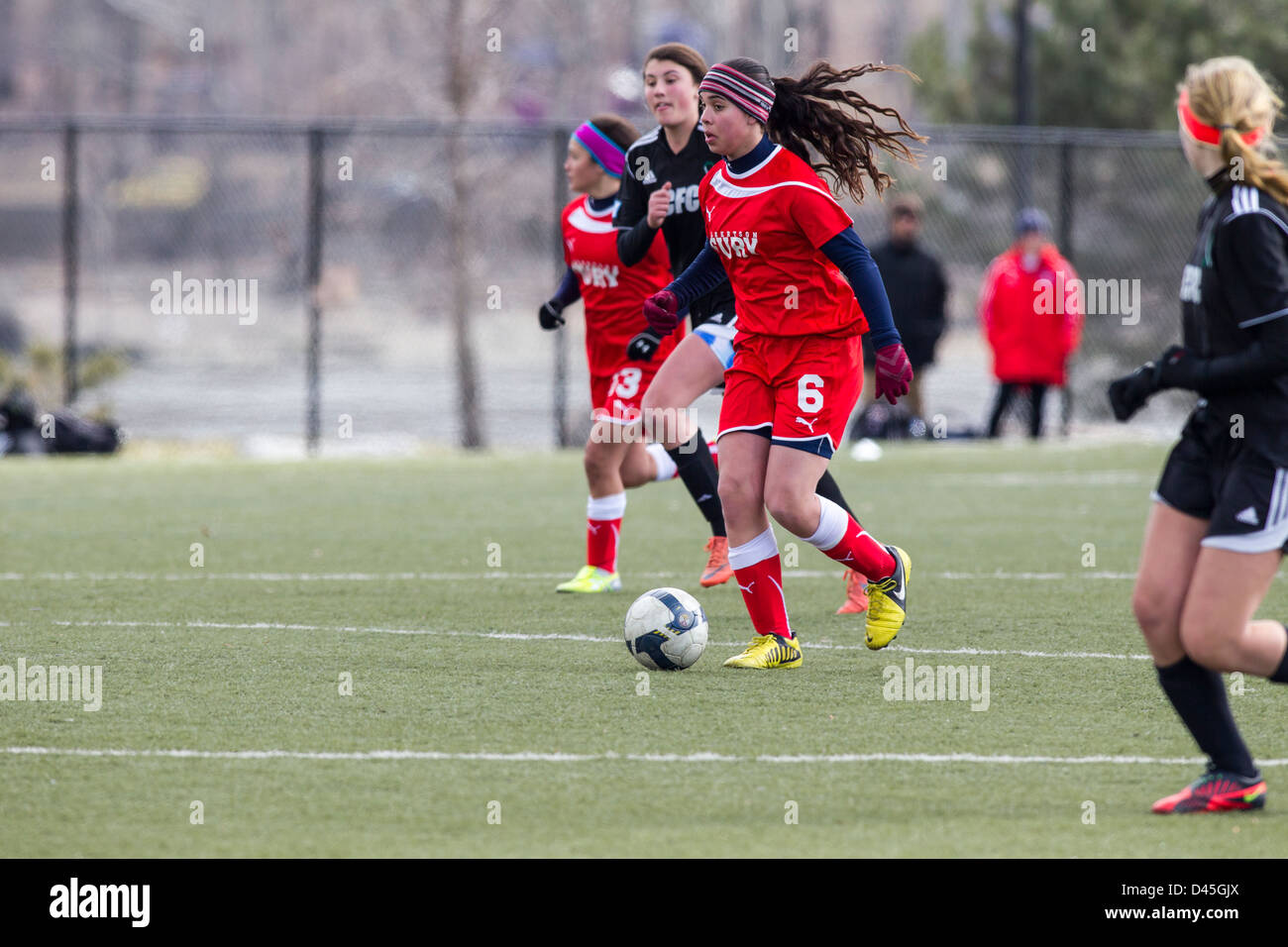 Teen girls soccer action Stock Photo - Alamy
