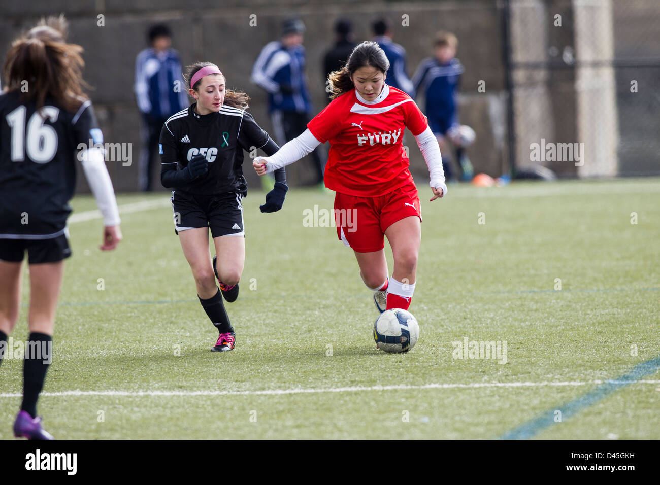 Teen girls soccer action Stock Photo - Alamy
