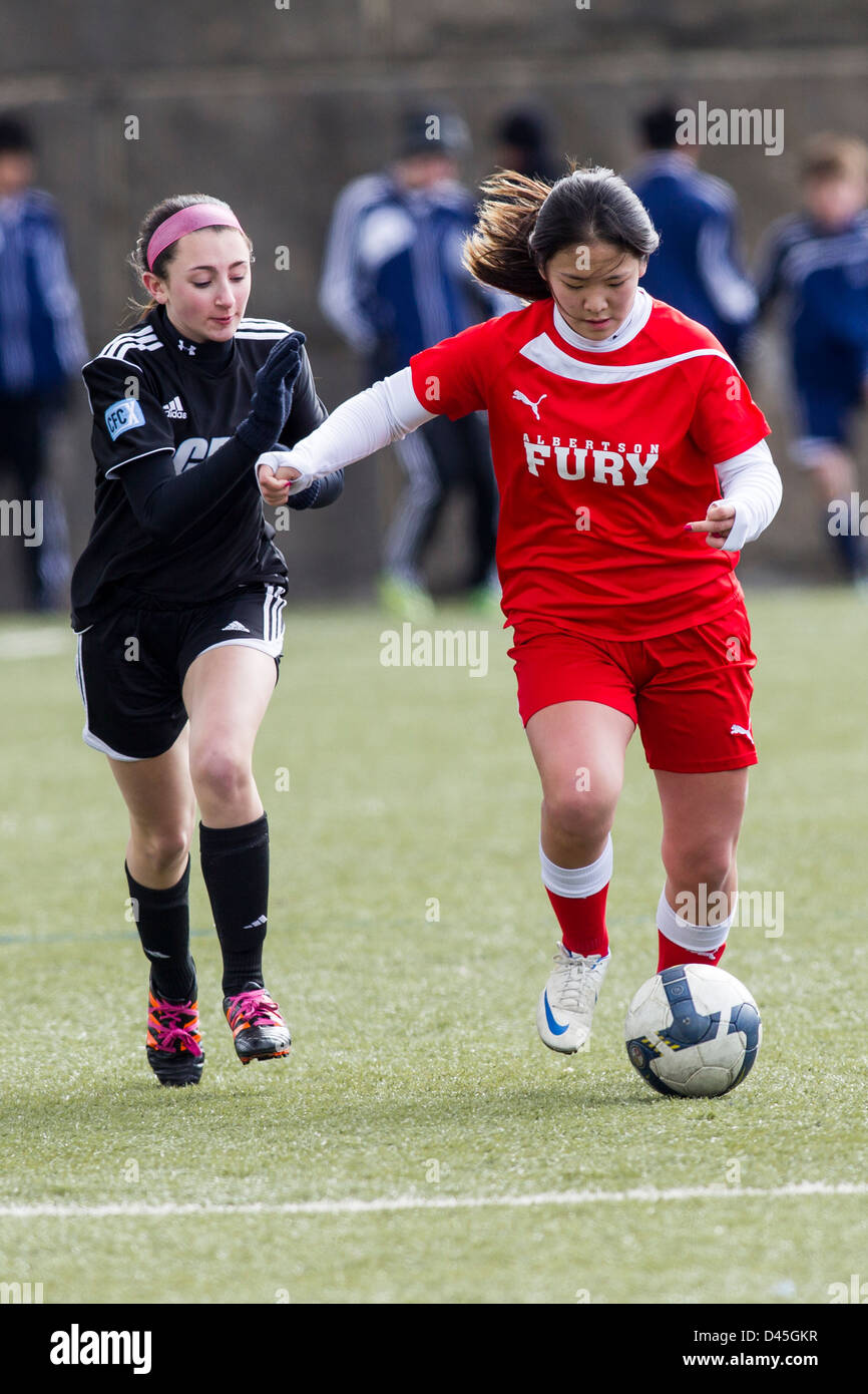 Teen girls soccer action Stock Photo - Alamy