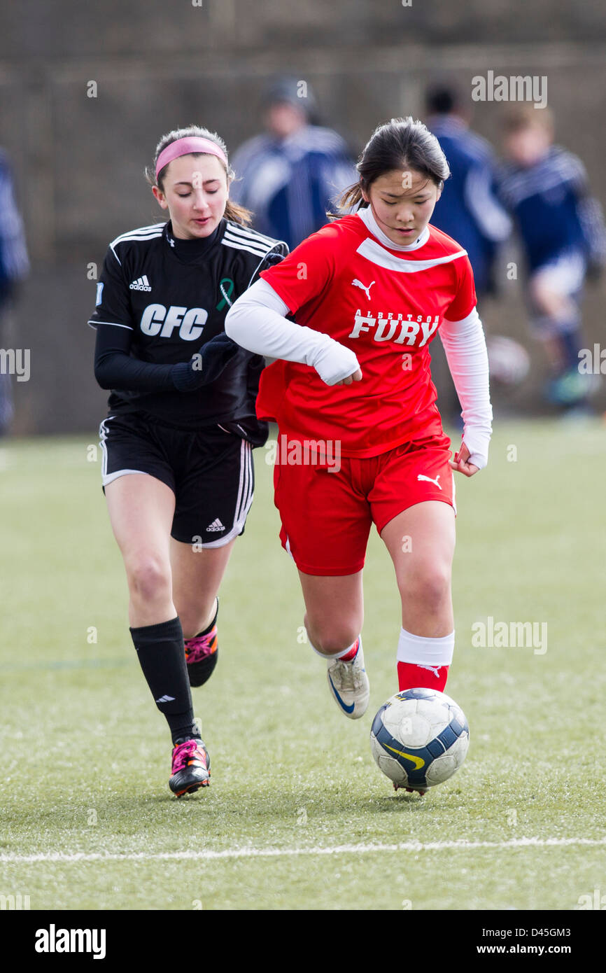 Teen girls soccer action Stock Photo - Alamy