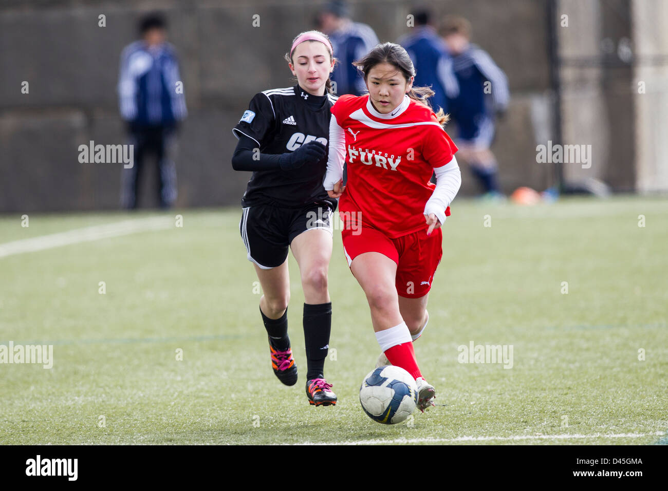 Teen girls soccer action Stock Photo - Alamy