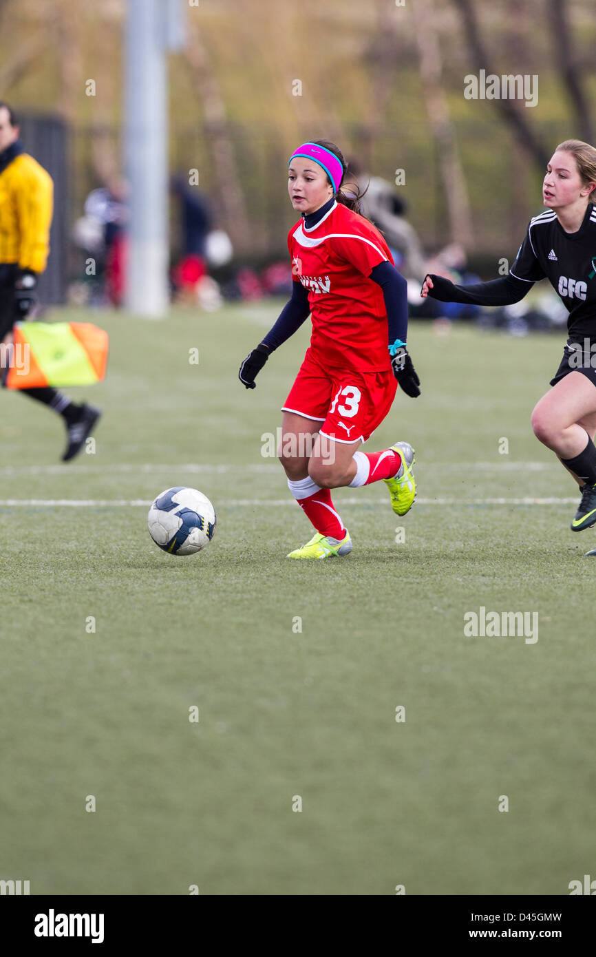 Teen girls soccer action Stock Photo - Alamy