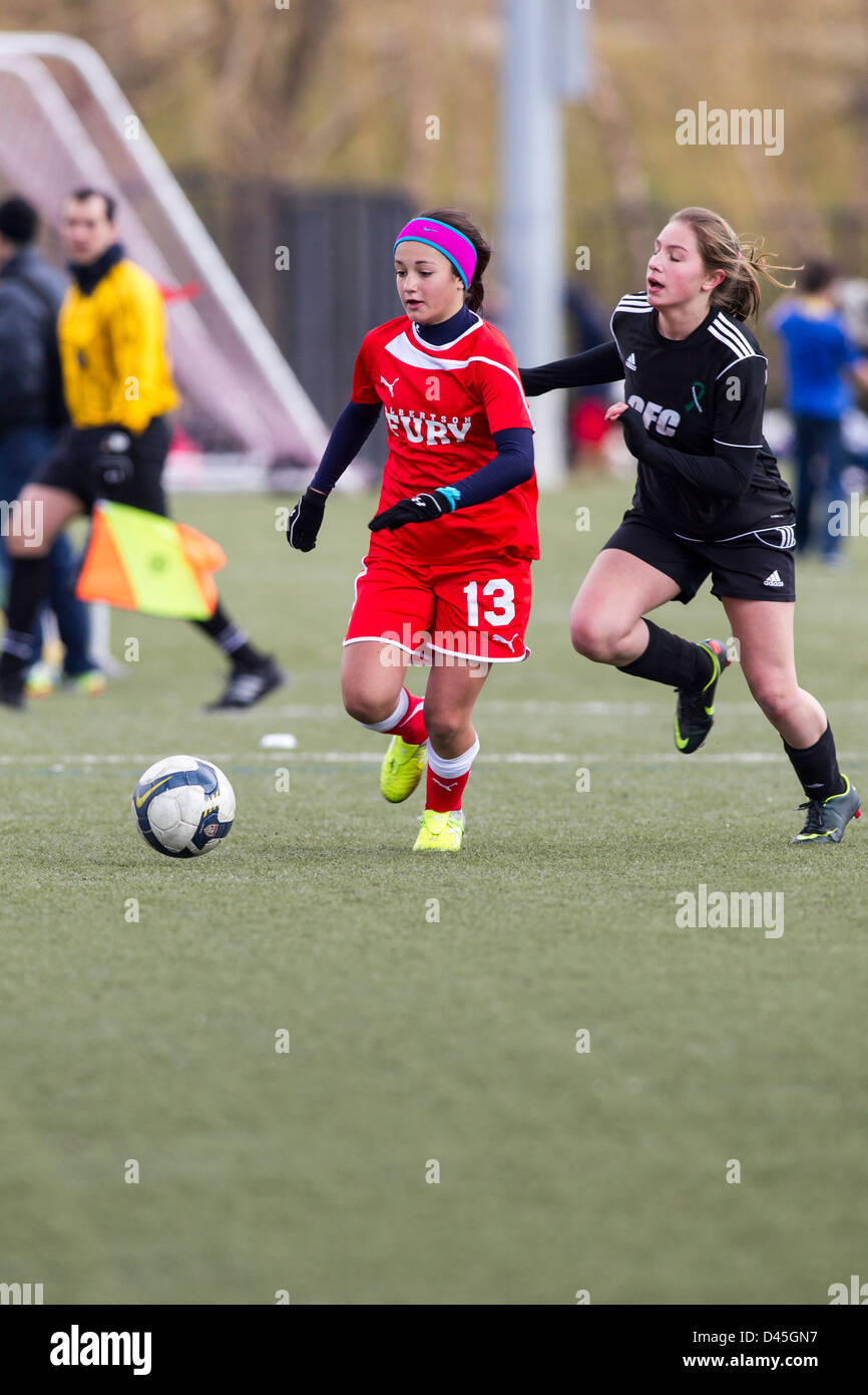 Teen girls soccer action Stock Photo - Alamy