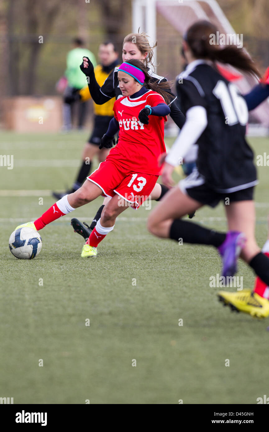 Teen girls soccer action Stock Photo - Alamy