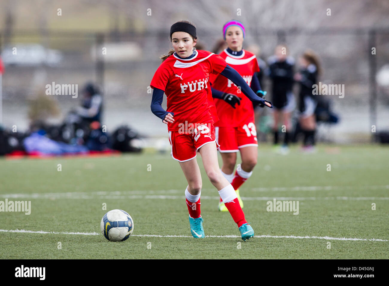 Teen girls soccer action Stock Photo - Alamy
