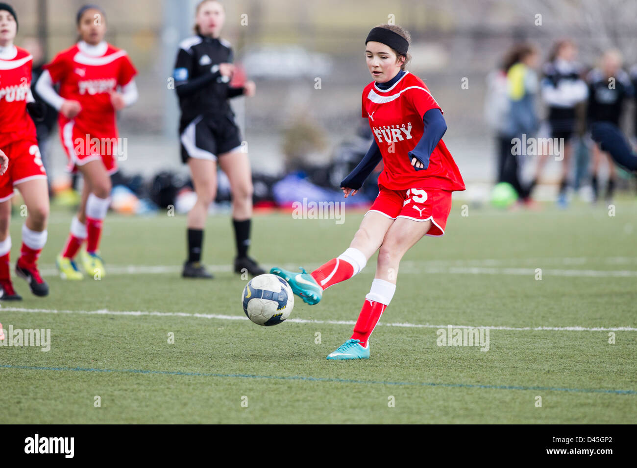 Teen girls soccer action Stock Photo - Alamy