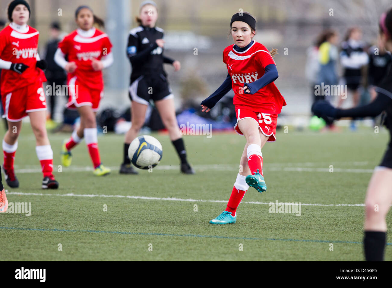 Teen girls soccer action Stock Photo - Alamy