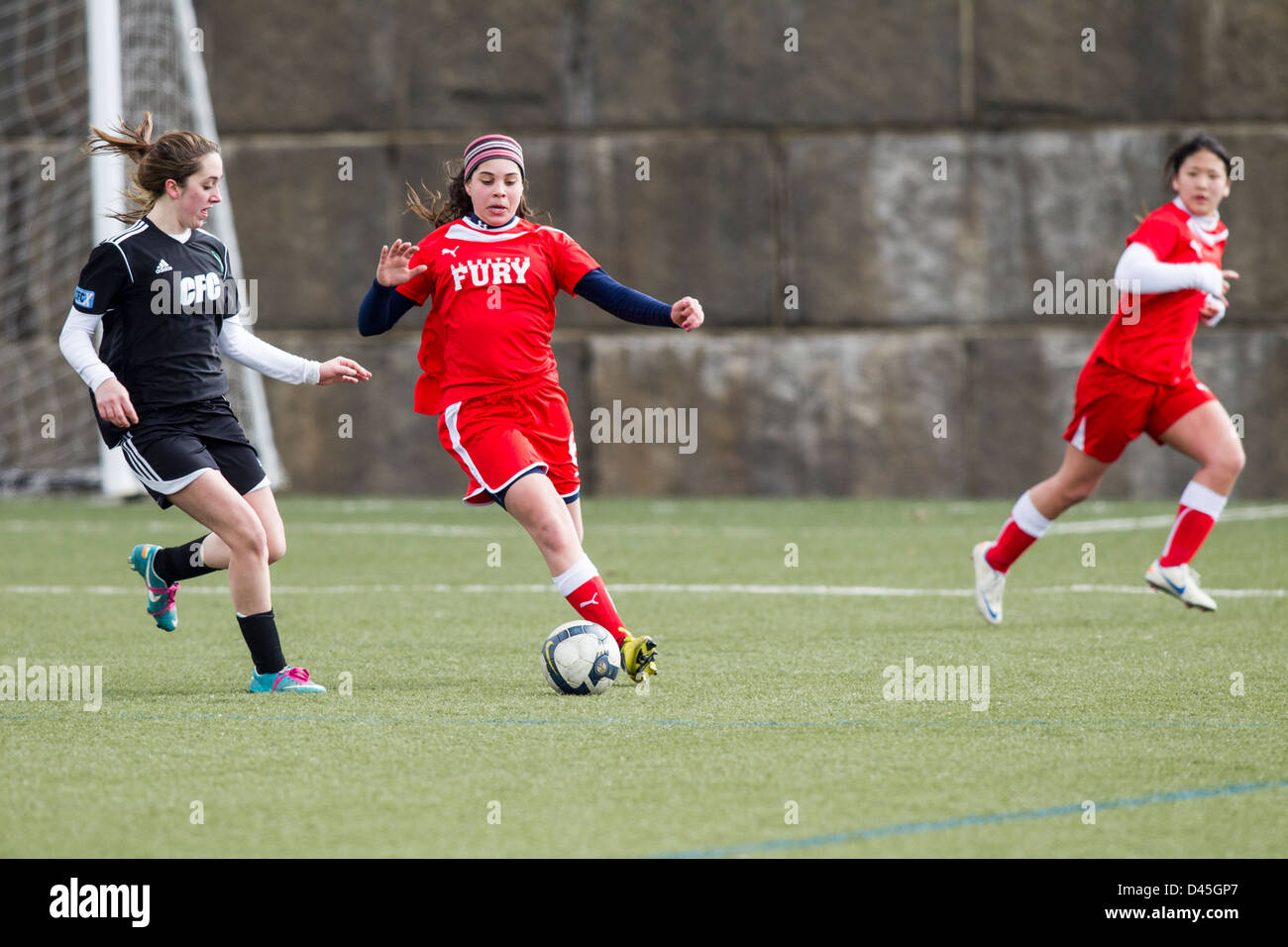 Teen girls soccer action Stock Photo - Alamy