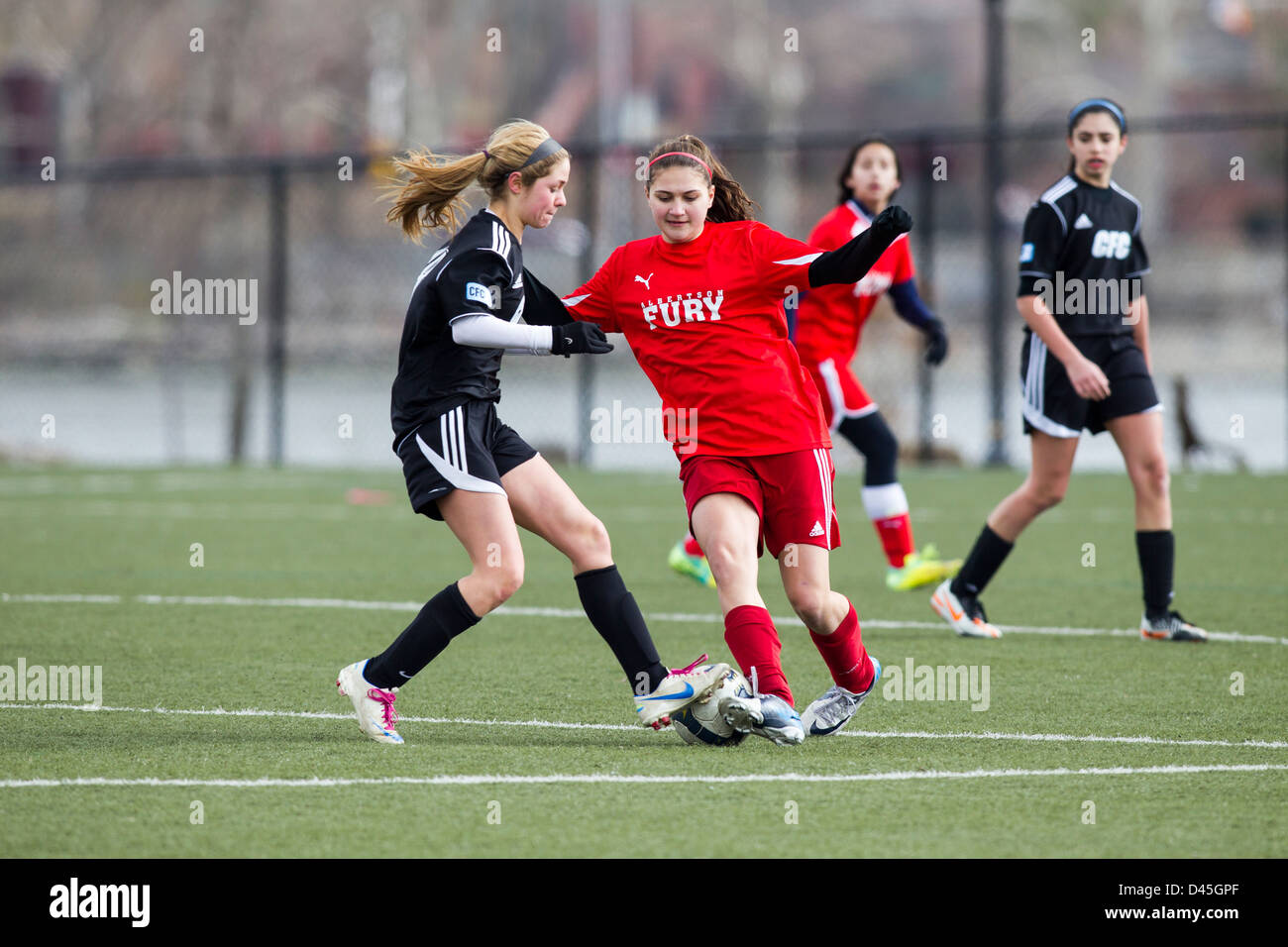 Teen girls soccer action Stock Photo - Alamy