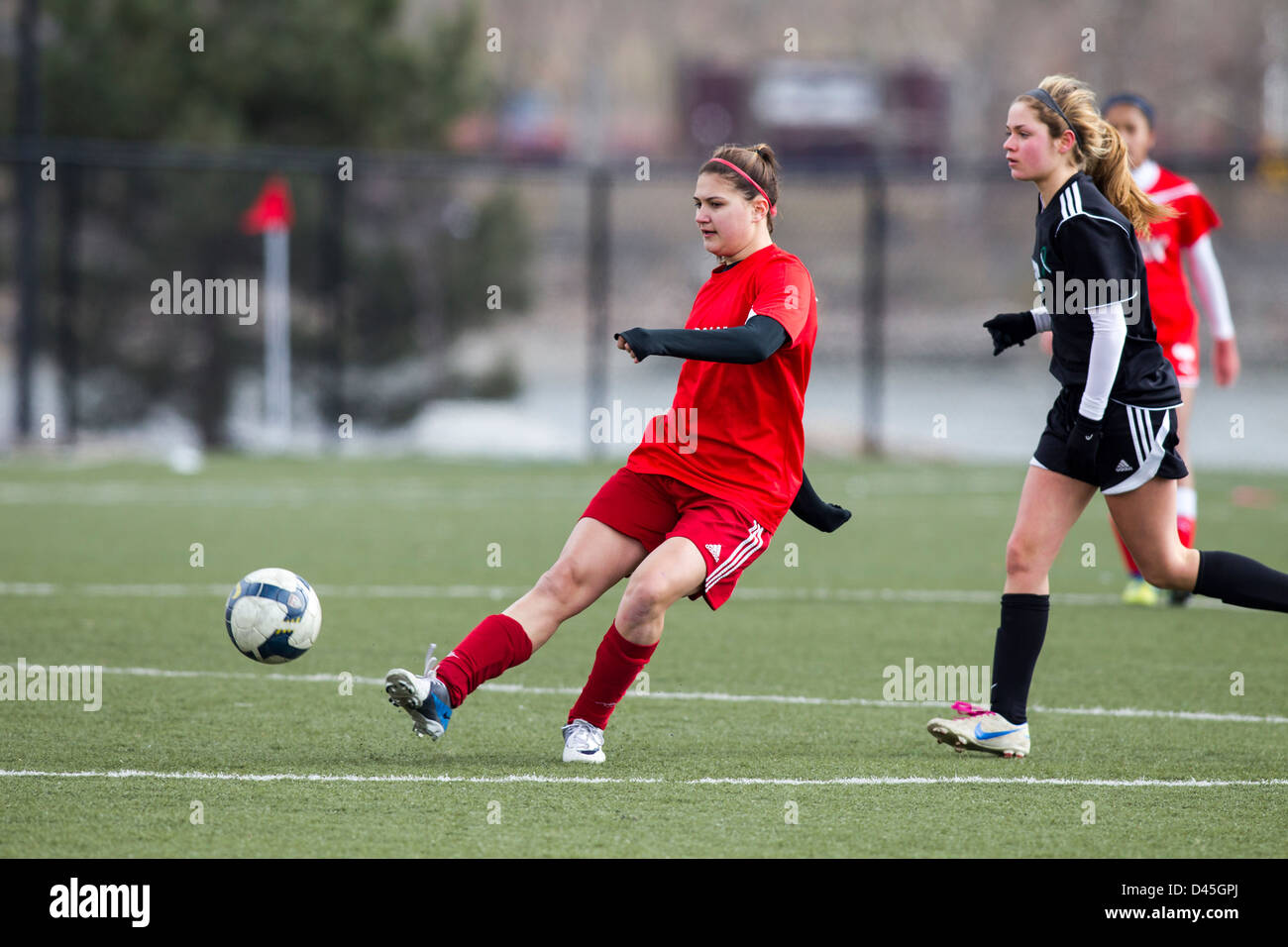Teen girls soccer action Stock Photo - Alamy