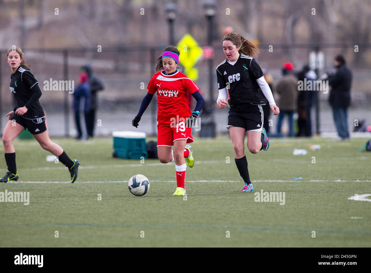 Teen girls soccer action Stock Photo - Alamy