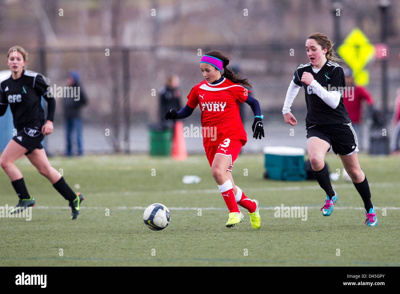 Teen girls soccer action Stock Photo - Alamy