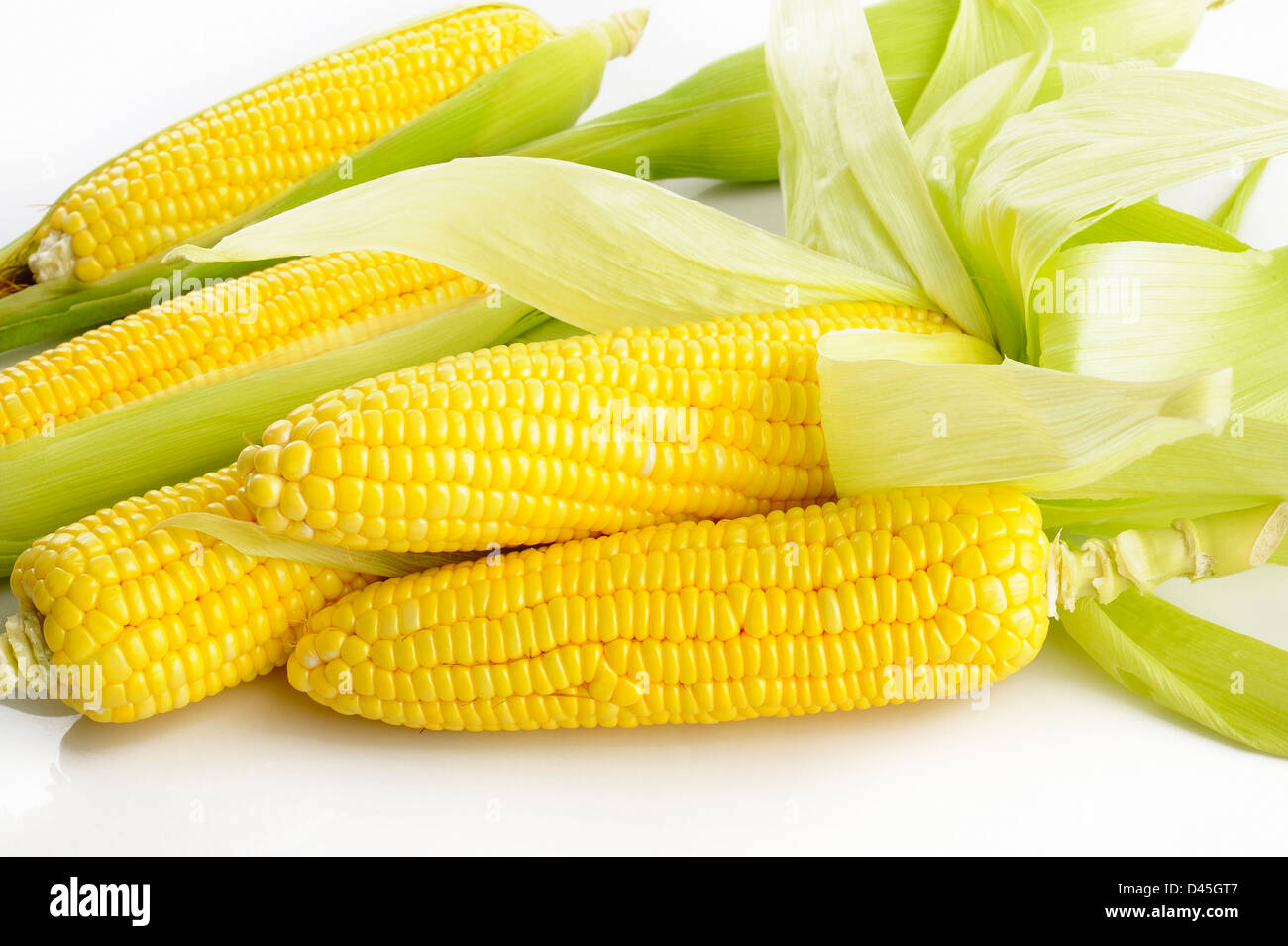 raw corn on white background Stock Photo - Alamy