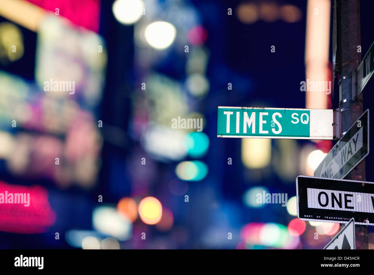 Times Square Street Sign Against Light Blurs Stock Photo - Alamy