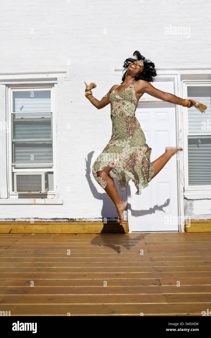 Woman Jumping In Dress