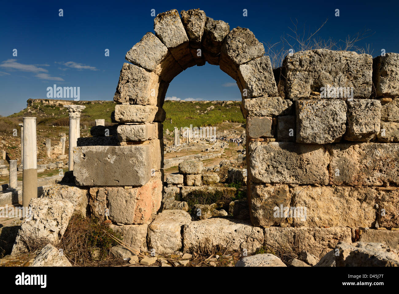 View through an arch of the main street colonade with pool and ...
