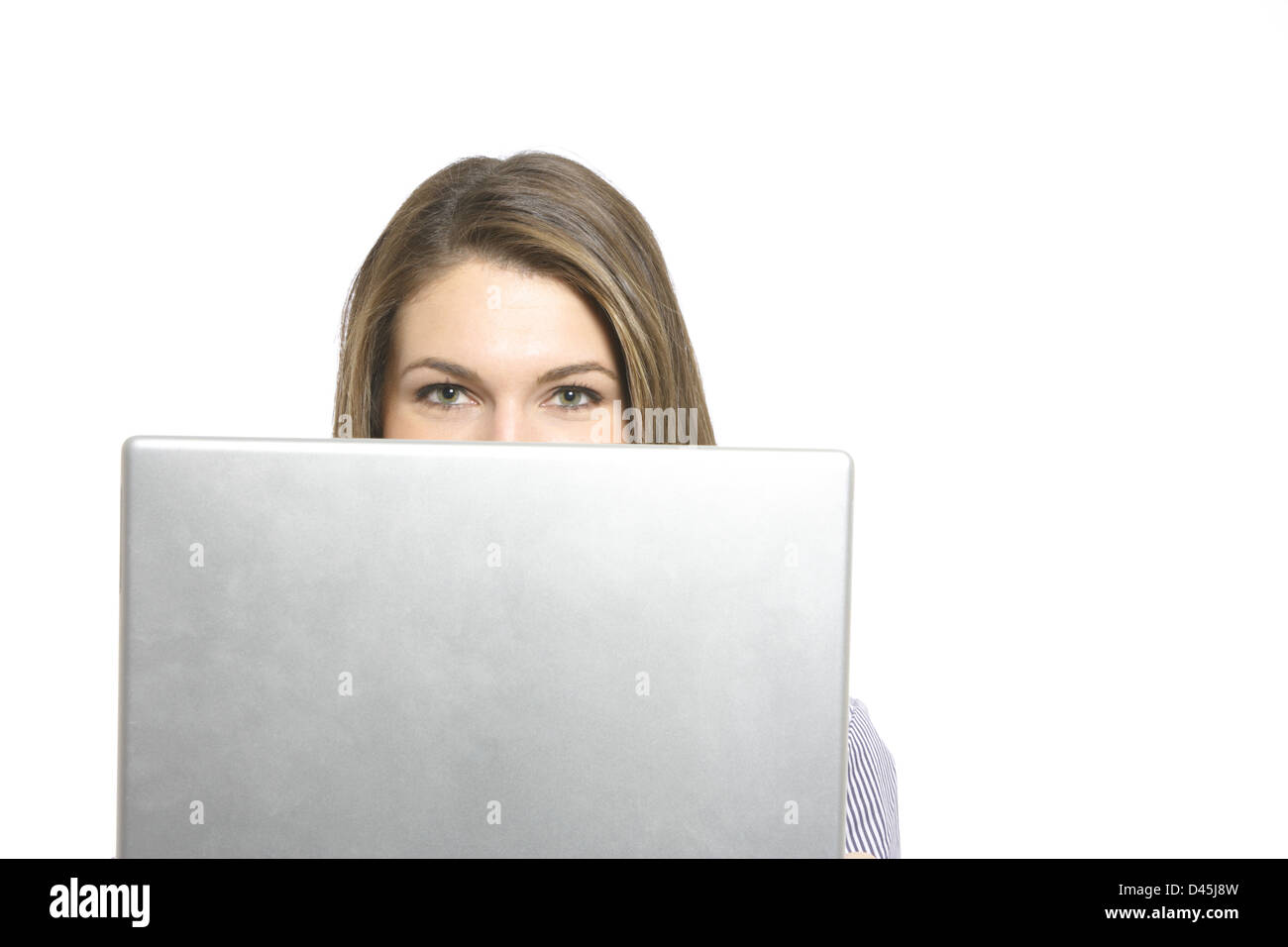 A business woman looking over her laptop in the studio Stock Photo - Alamy