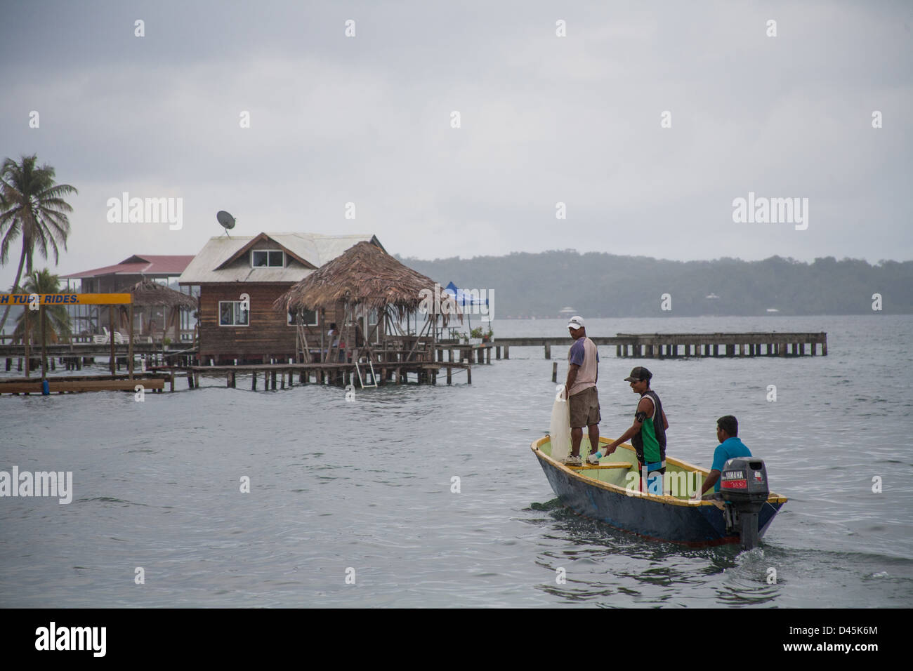 Panamanians fishing from a boat near the shore of Carenero Island Stock ...