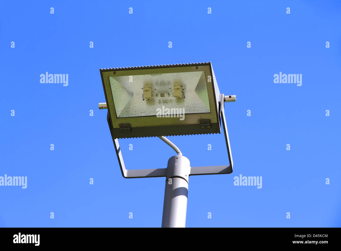 A flood light in front of a blue sky Stock Photo - Alamy