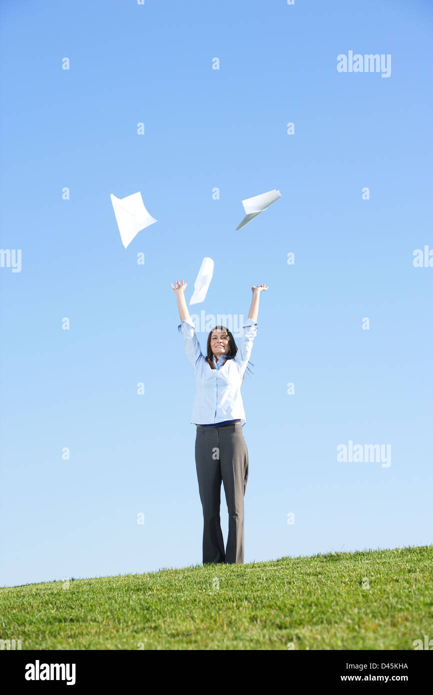 A business woman freeing herself from her work load Stock Photo - Alamy