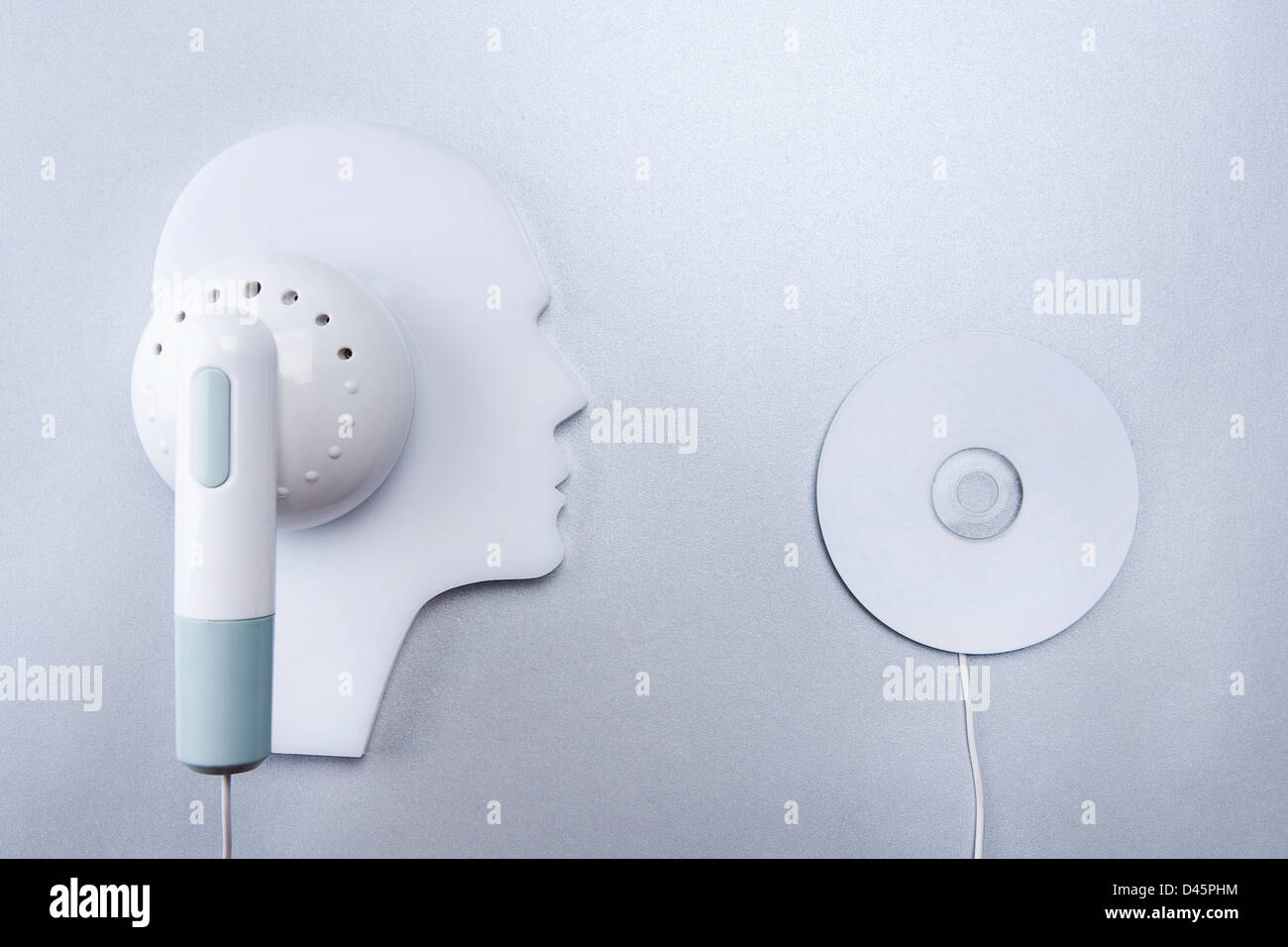 human head icon listening to a cd Stock Photo - Alamy