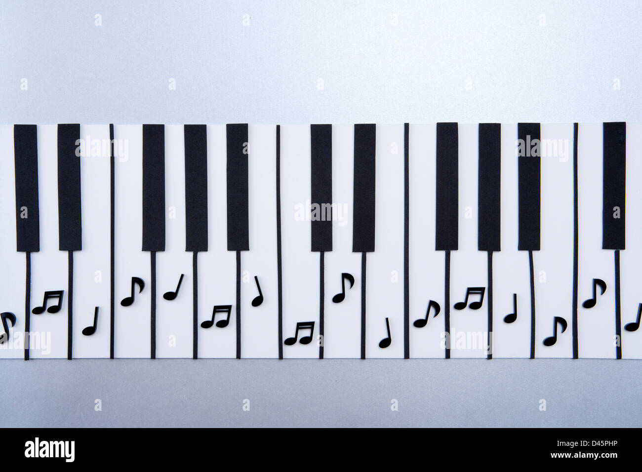 musical notes on a piano keyboard Stock Photo - Alamy