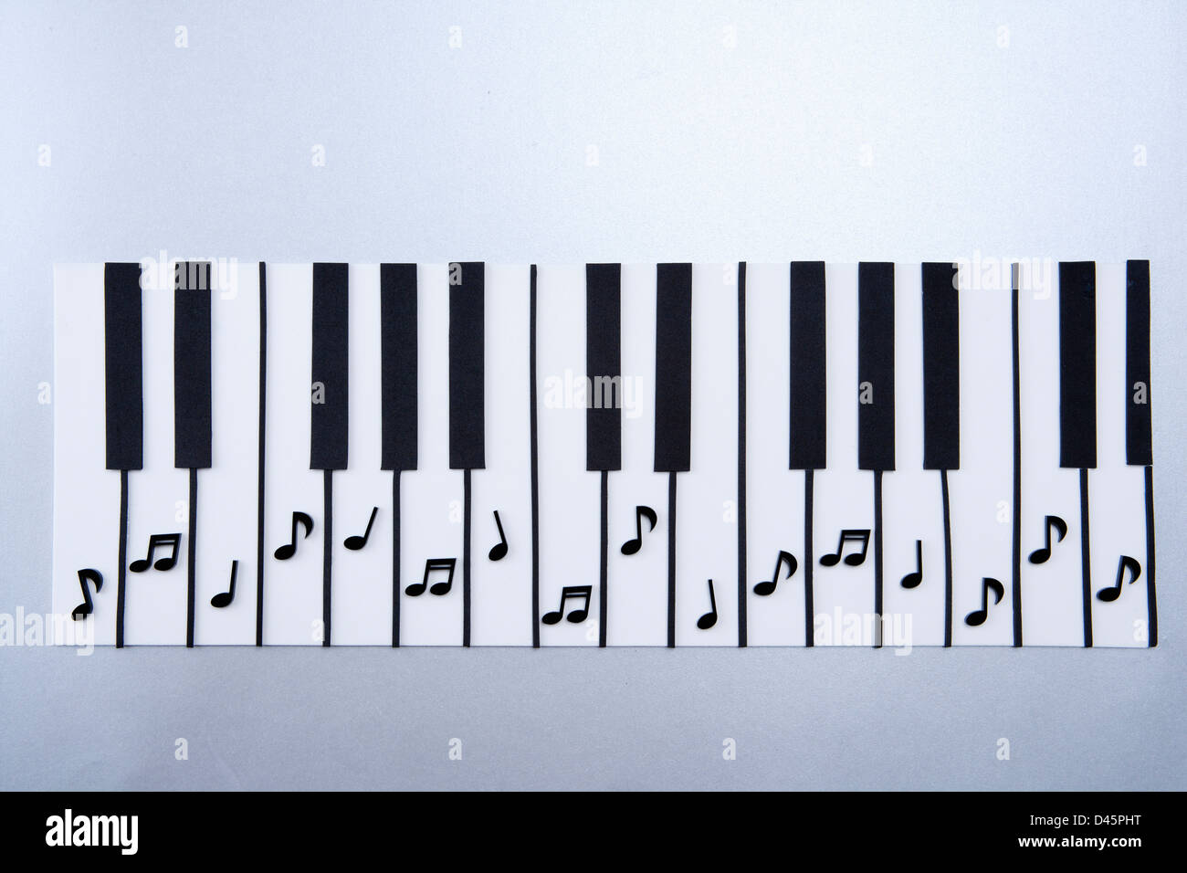 musical notes on a piano keyboard Stock Photo - Alamy