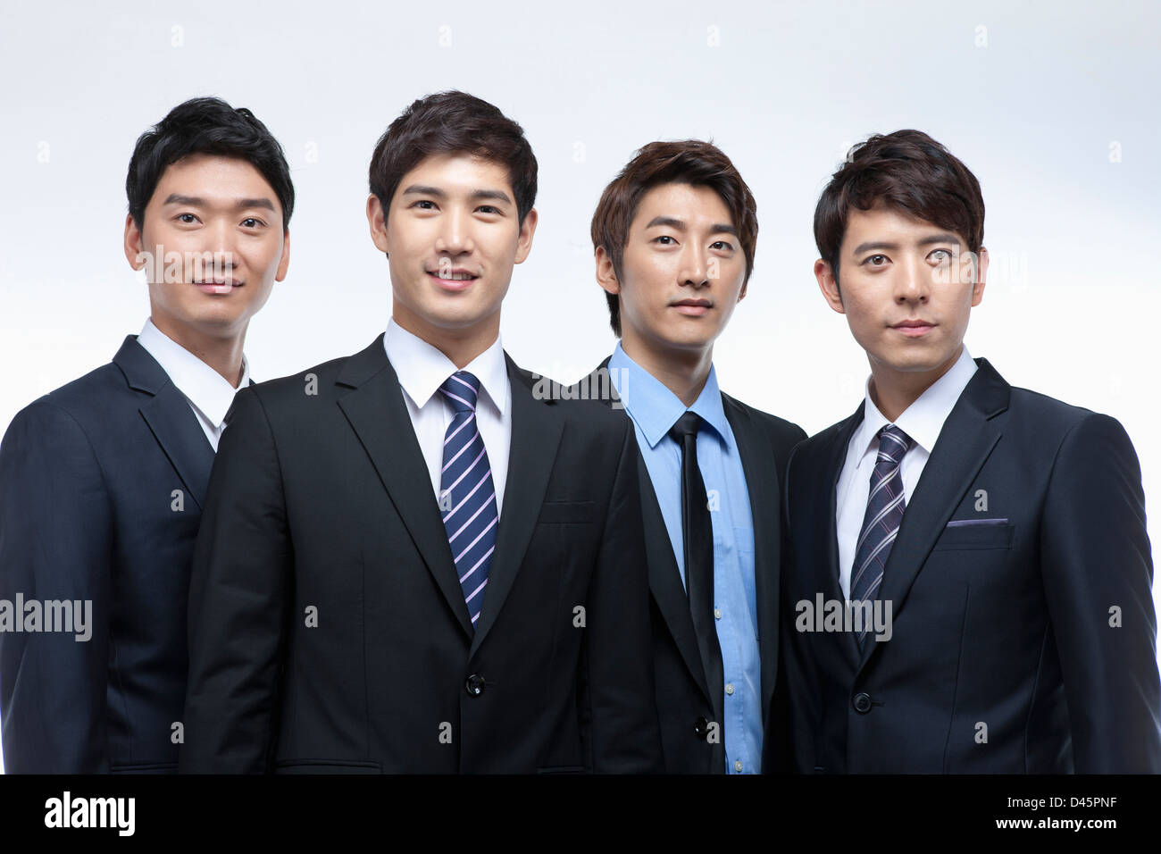 group of businessmen posing in a line Stock Photo - Alamy