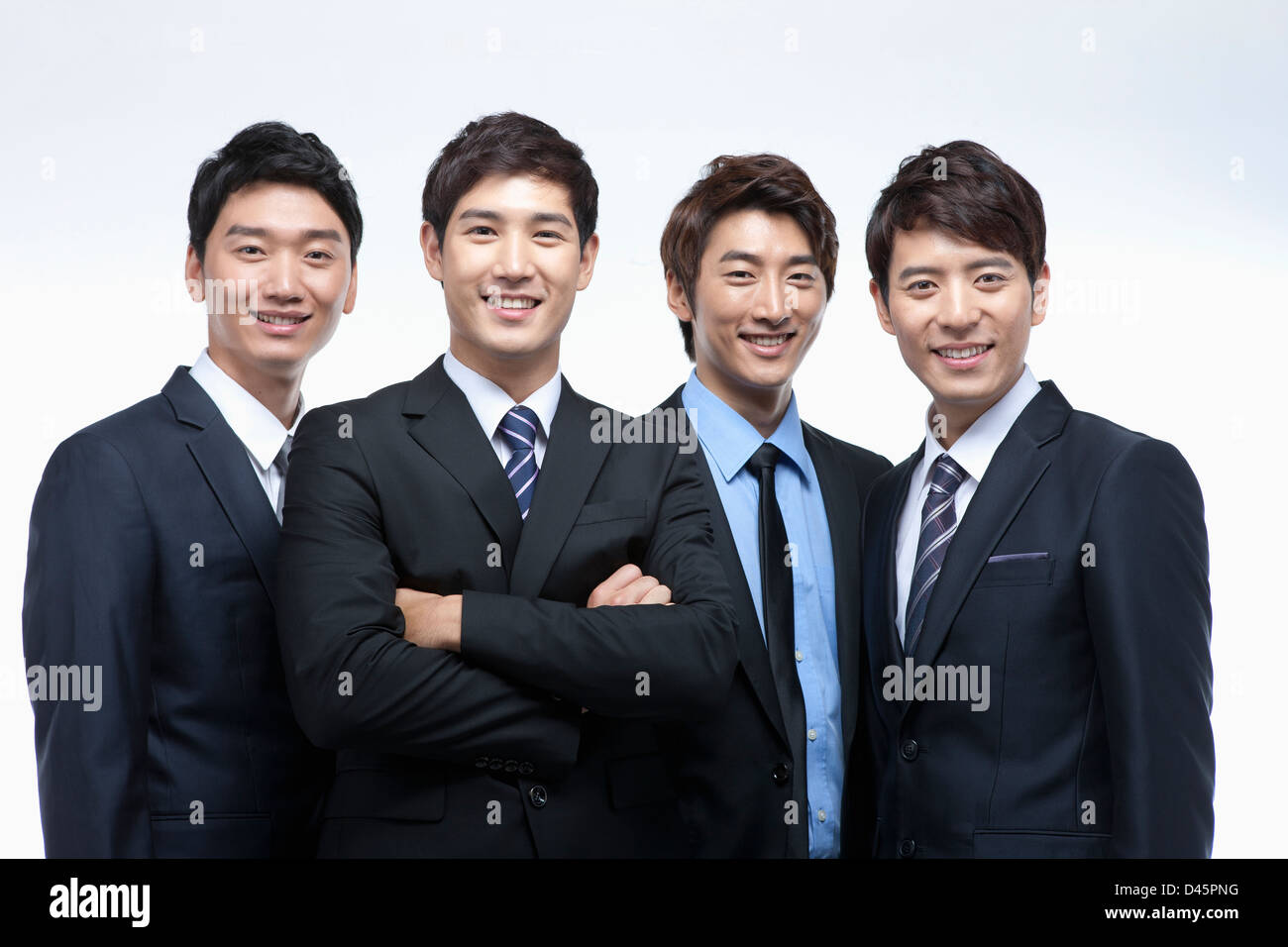 group of businessmen posing in a line Stock Photo - Alamy