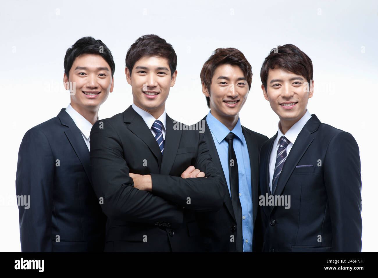 group of businessmen posing in a line Stock Photo - Alamy