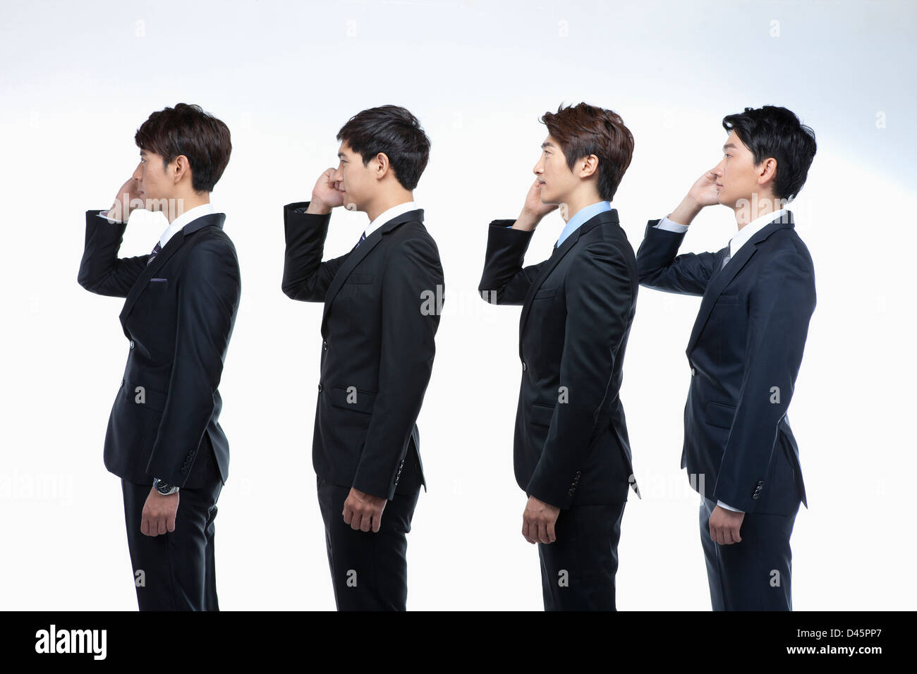 businessmen saluting in a line Stock Photo - Alamy