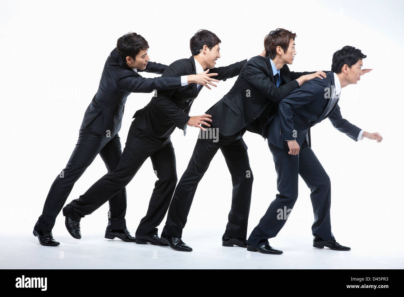 businessman in a line trying to reach further Stock Photo - Alamy