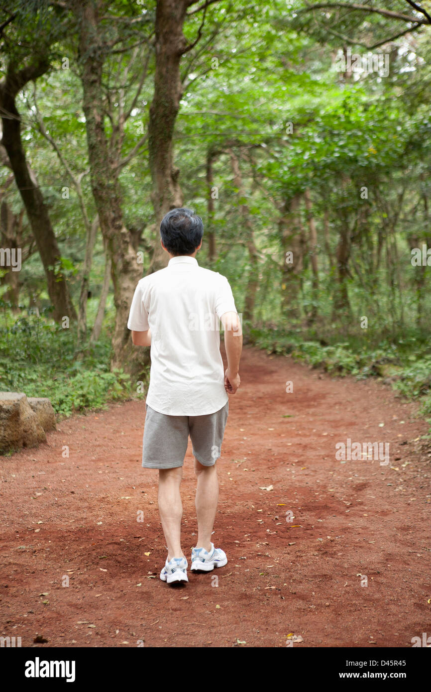 middle age man taking a walk in nature Stock Photo - Alamy