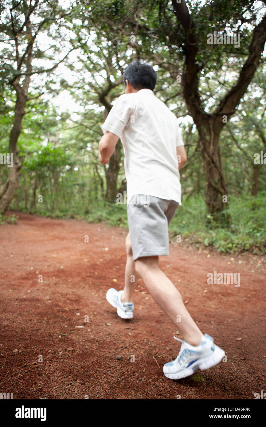 Middle man running behind hi-res stock photography and images - Alamy