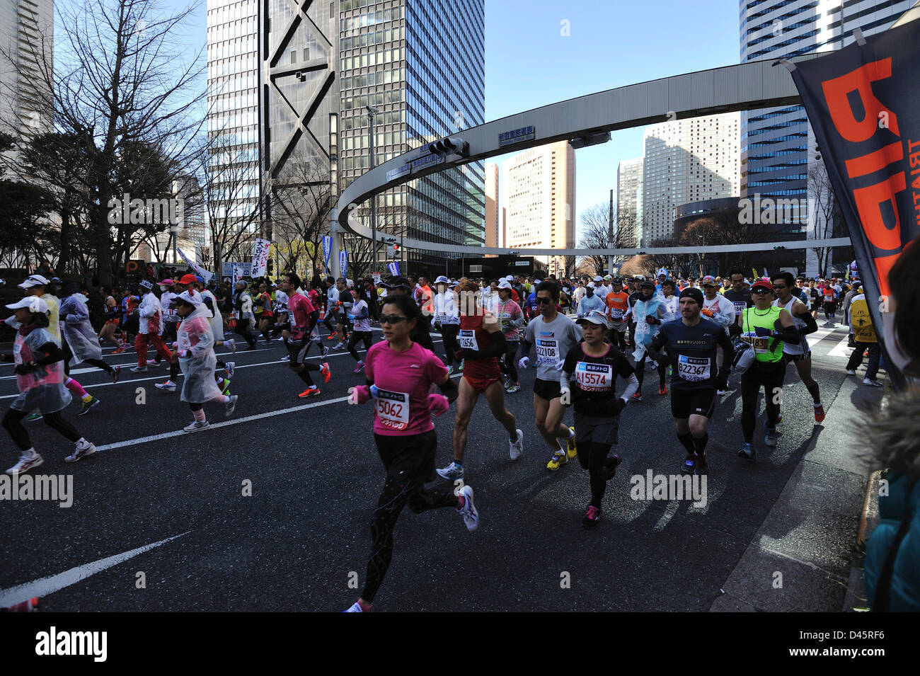 February 24, 2013, Tokyo, Japan - Runners make their way past Shinjuku ...